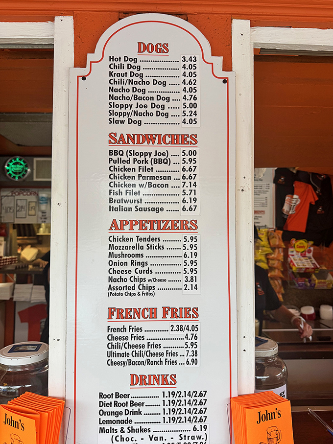 The menu board showcases a mouthwatering array of classic dogs, from simple hot dogs to loaded chili-nacho creations that demand extra napkins.