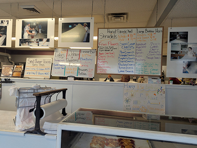 Handwritten menu boards showcase a dazzling array of European delights, from classic strudels to Hungarian kifli, each promising buttery bliss.