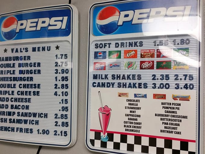 The classic menu board showcases Val's straightforward offerings &ndash; no fancy frills, just American comfort food perfected over decades.