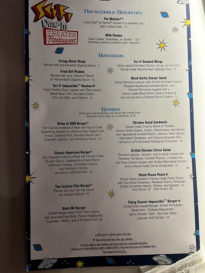 The menu reads like a diner met a spaceship, featuring everything from BBQ burgers to Flying Saucer Impossible Burgers for the extraterrestrials watching their cholesterol.
