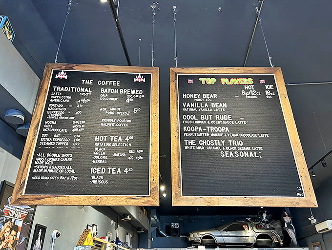 The menu board reveals creative concoctions like "Koopa-Troopa" and "Cool But Rude" &ndash; nostalgic names that deliver serious flavor alongside traditional coffee offerings.