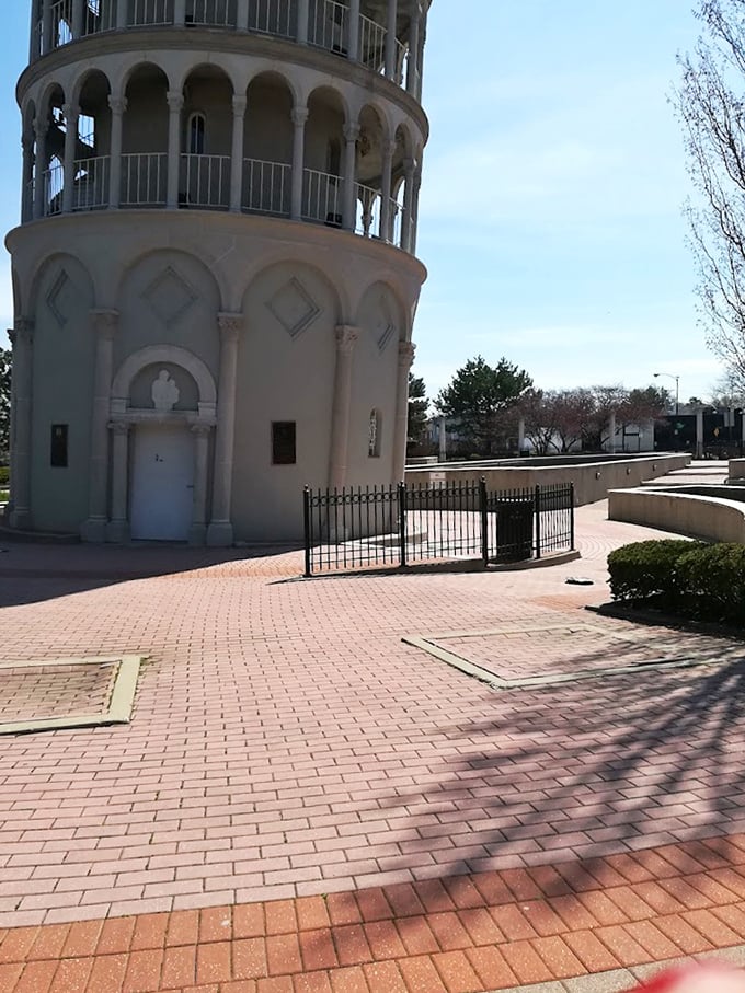 The base of the tower reveals intricate architectural details, with arched doorways and decorative elements that pay homage to its Italian inspiration.