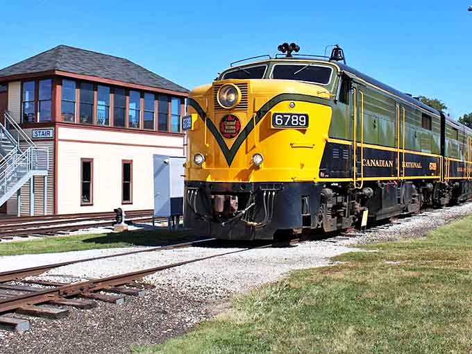Sunshine on wheels! This vibrant Canadian National diesel locomotive proves that trains weren't just transportation – they were rolling works of art.