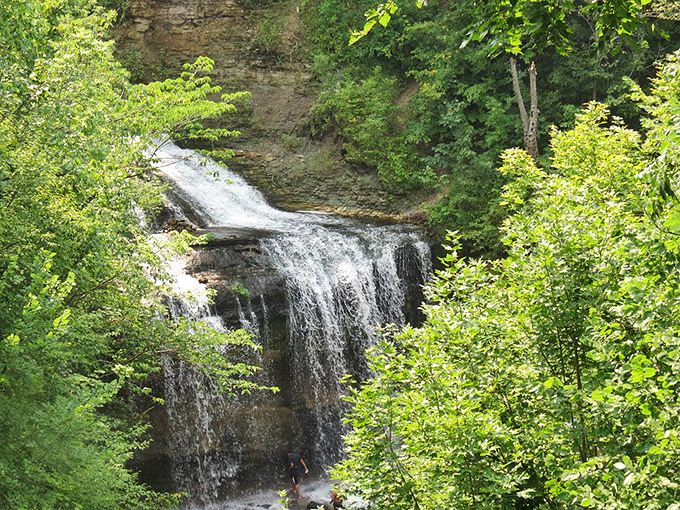 Cascade Falls creates a magical grotto experience just steps from downtown Osceola, where sandstone walls frame the tumbling water like a natural theater.