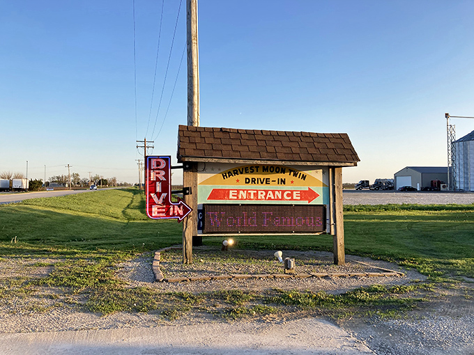 The Harvest Moon Drive-In's rustic entrance sign points the way to movie magic, a humble gateway to unforgettable summer nights under the stars.
