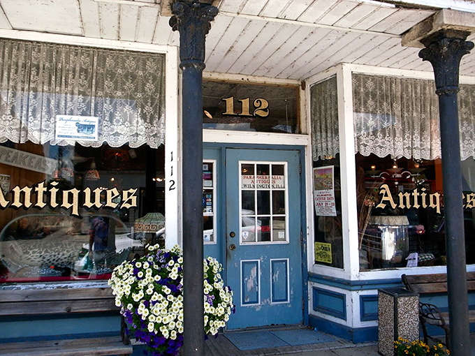 Paraphernalia Antiques' charming blue door and lace curtains invite you into a world where time stands still and treasures await.