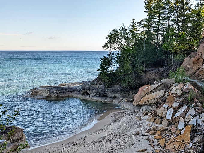 Twelvemile Beach stretches as far as the eye can see, with emerald waters hugging the shoreline beneath dramatic cliffs.
