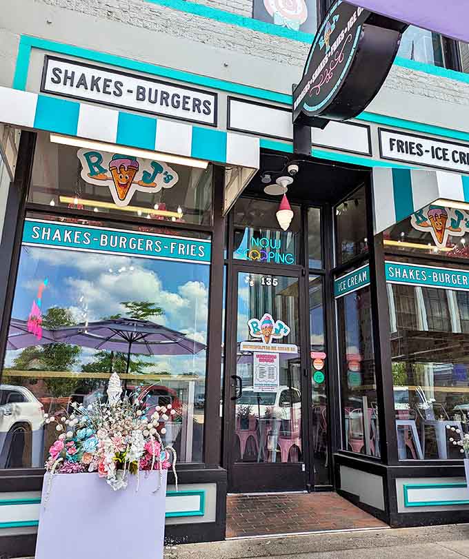 Modern meets retro at RJ's Metropolitan Ice Cream Co., where the "Shakes-Burgers-Fries" sign promises more than just dessert. The colorful flower displays add charm to this downtown destination.