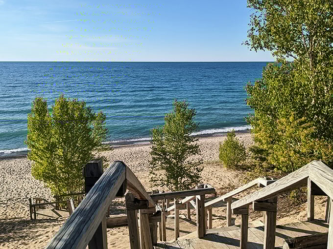 The rugged beauty of Pictured Rocks National Lakeshore, where rocky outcroppings frame a secluded beach perfect for peaceful exploration.