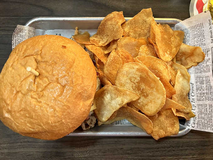 These twisted pigs aren't flying – they're nestled in a perfect bun with house-made chips that shatter like stained glass between your teeth.