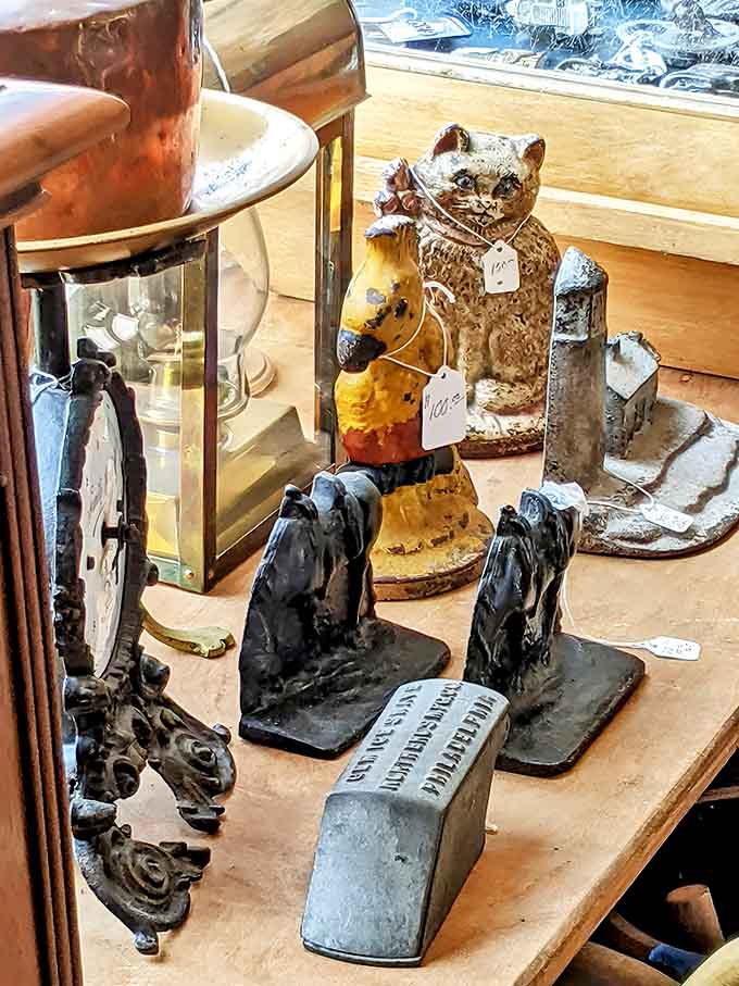 Whimsical figurines and practical antiques share space on these shelves, each item patiently waiting for its next chapter to begin.