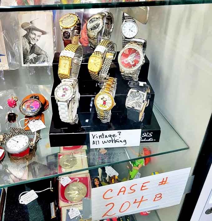 "Vintage? All working" promises the handwritten sign, offering wrist-bound time machines that still tick with mechanical precision decades later.