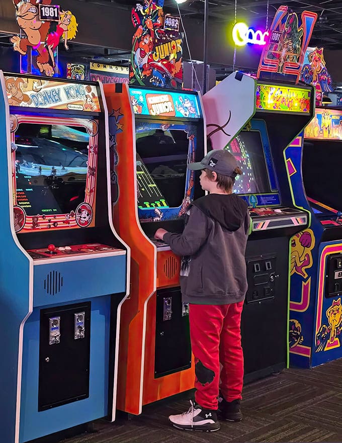 Vintage cabinets stand like sentinels of gaming history, their pixelated challenges just as addictive now as decades ago.