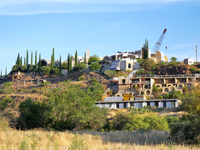 Perched dramatically on the hillside, Arcosanti's complex resembles a movie set where Mad Max meets sustainable architecture.