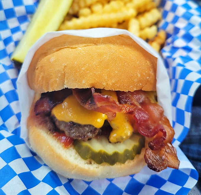 That bacon cheeseburger sits there all smug and delicious, knowing full well it's about to make you forget every salad you've ever considered eating.