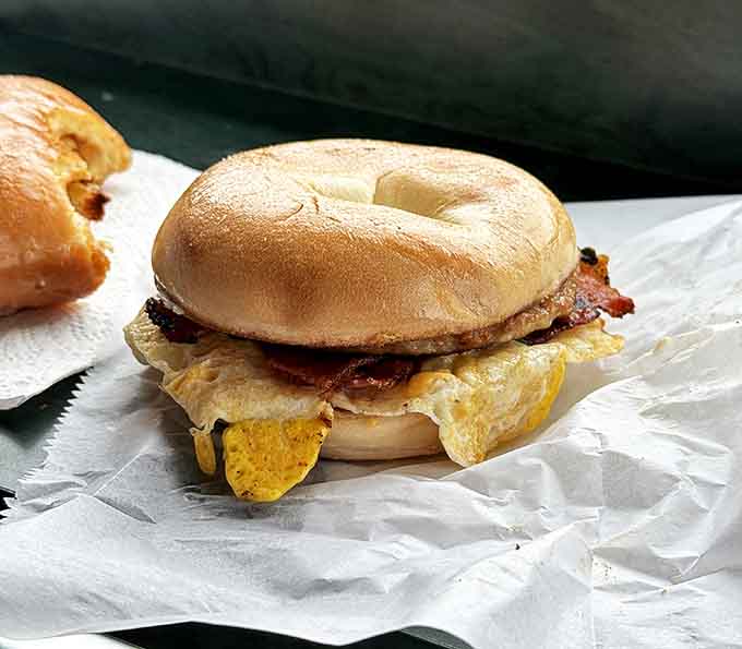 Eggs and bacon nestled in a fresh bagel &ndash; proof that even the "safe choice" here is extraordinary.