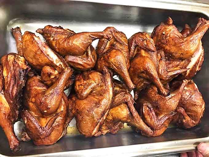 These barbecue chickens have achieved the impossible: crispy skin and juicy meat, a smoky miracle that keeps customers coming back.