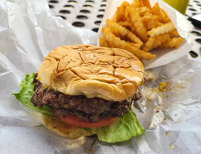 This isn't just a burger – it's edible poetry. Notice how the patty peeks out just right, promising juicy perfection with every bite.