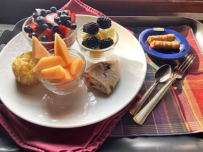 Morning magic on a plate &ndash; fresh berries, cantaloupe, and homemade pastries start your day with a burst of color and flavor.