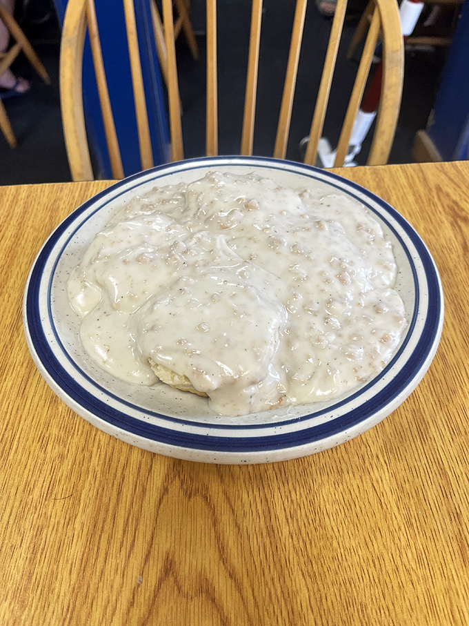 Behold the star attraction &ndash; pillowy biscuits drowning in pepper-flecked sausage gravy that could make a grown Floridian weep with joy.