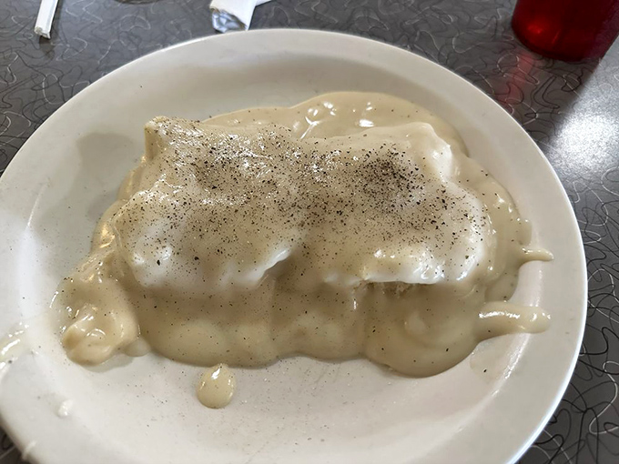 Biscuits and gravy that would make your grandmother weep with joy &ndash; creamy, peppery perfection blanketing cloud-like biscuits.