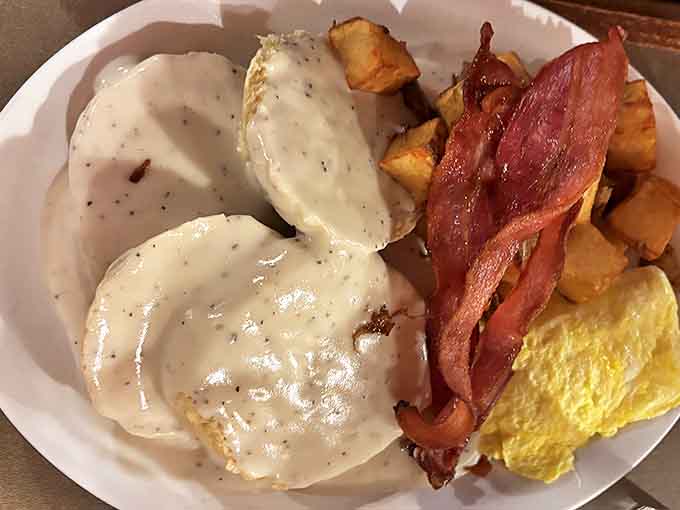 These biscuits and gravy could make a grown person weep with joy &ndash; fluffy clouds of dough swimming in peppery sausage gravy.