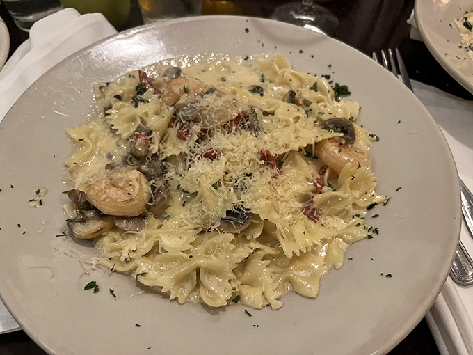 Bowtie Pasta: Perfectly al dente farfalle swimming in a creamy sauce with mushrooms and herbs &ndash; proof that sometimes the simplest pleasures are the most profound.