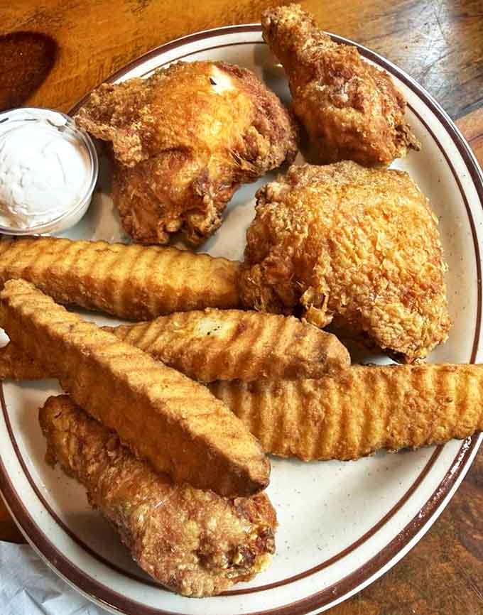 Golden-brown perfection on a plate: the legendary broasted chicken paired with crinkle-cut fries that'll make you forget all other potatoes.