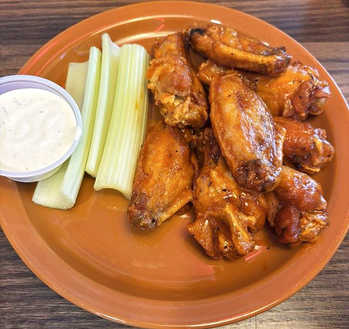 Buffalo wings that don't need a sporting event as an excuse. Crispy, saucy, and served with cooling celery sticks&mdash;a classic done right is always in style.