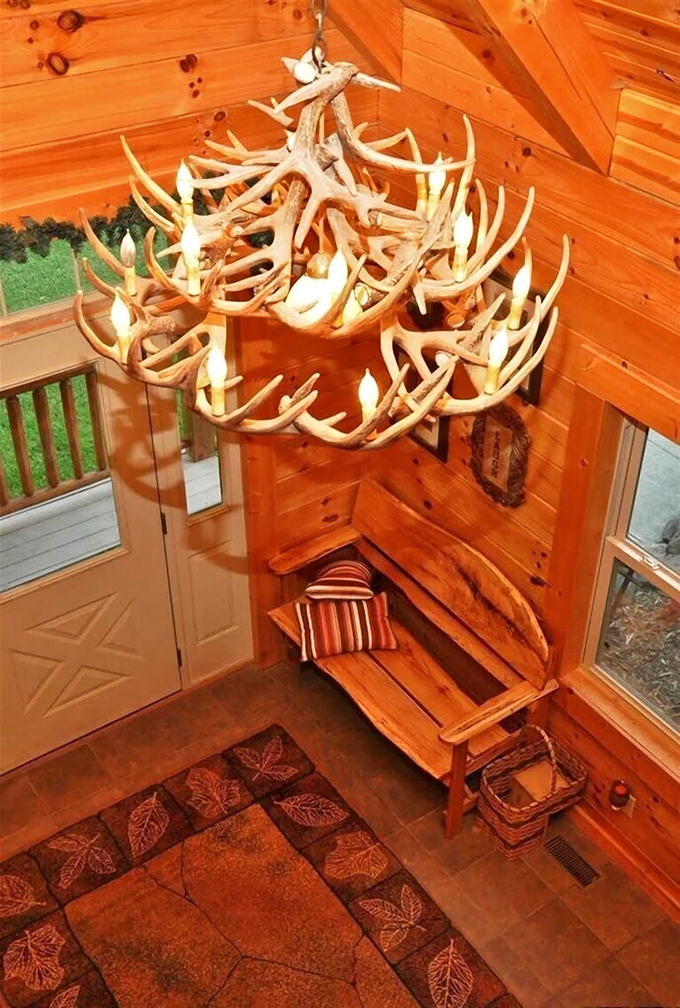 Not your average lighting fixture! This antler chandelier transforms ordinary illumination into a conversation piece that perfectly captures the lodge's rustic elegance.