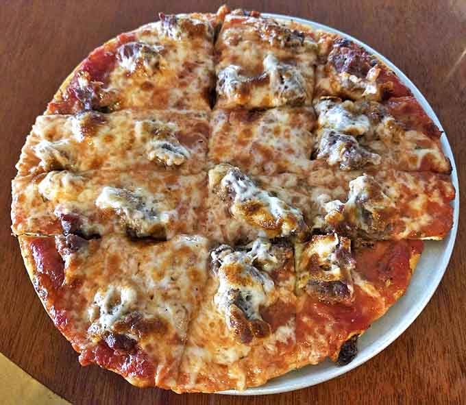 This mini cheese and sausage pizza showcases Quonset's perfect ratio of crispy thin crust, tangy sauce, melted cheese, and those glorious irregular chunks of house-made Italian sausage.