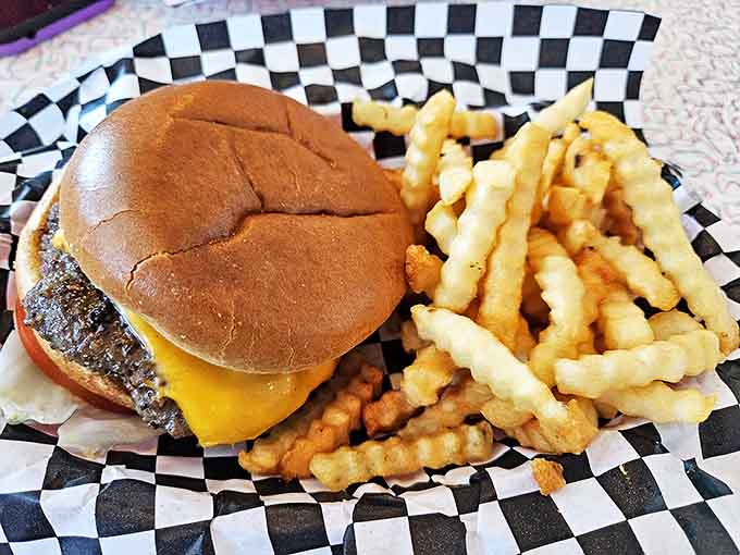 This isn't some deconstructed culinary experiment &ndash; it's a proper American cheeseburger with crinkle-cut fries that would make your grandfather nod in approval.