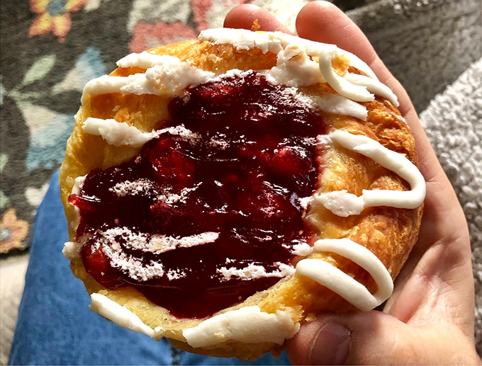 A cherry Danish that could make a grown adult weep with joy—tart fruit nestled in buttery pastry with delicate icing drizzled just so.