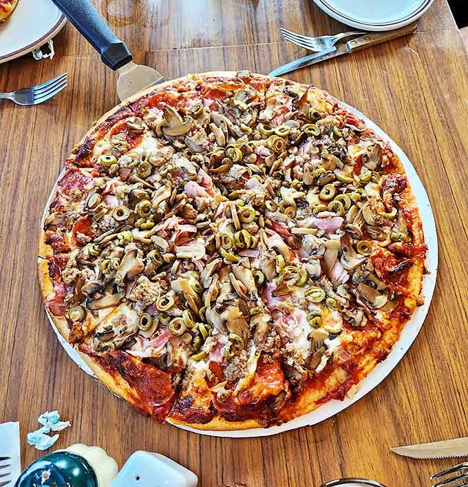 The legendary Super Pizza arrives loaded with toppings from edge to edge &ndash; this isn't just dinner, it's an edible adventure.