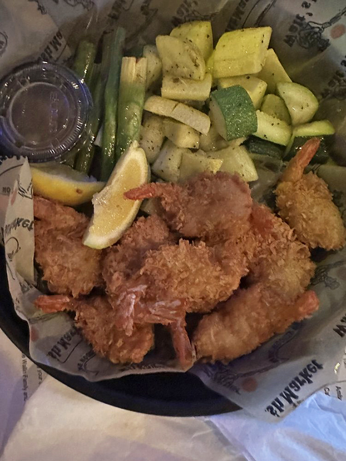 Golden-brown treasures from the deep, these crispy shrimp wear their coconut coating like beachside formalwear, ready for their dipping sauce dance.