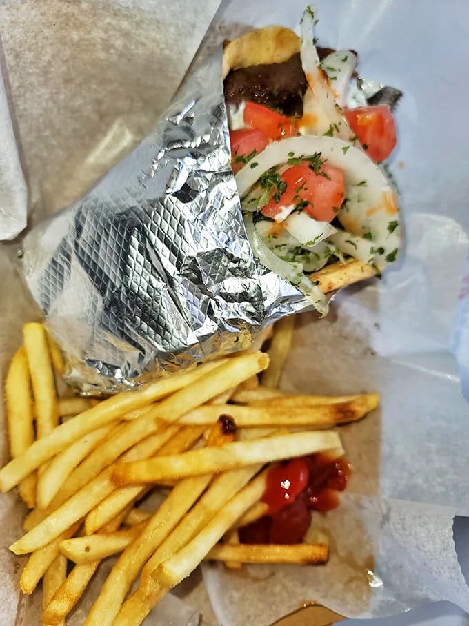 A perfect marriage of worlds &ndash; tender gyro meat wrapped in warm pita alongside golden fries, creating the lunch combo that's launched a thousand Kalamazoo food cravings.