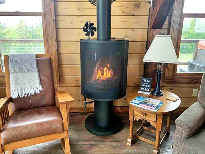 The modern gas stove creates a mesmerizing focal point, its dancing flames promising warmth for both body and soul on cool Wisconsin evenings.
