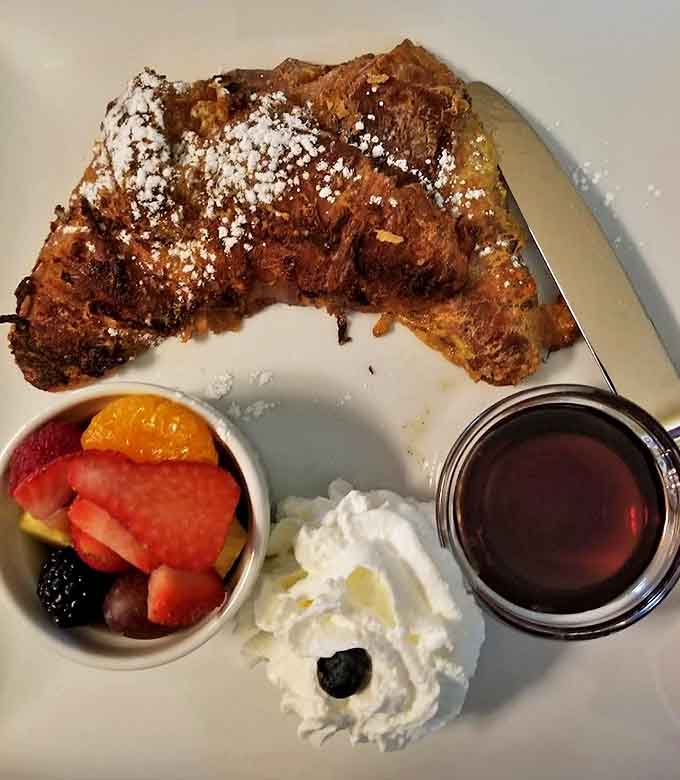 Yesterday's croissants transformed into today's breakfast masterpiece &ndash; proof that even perfection can be improved upon with maple syrup and fresh berries.