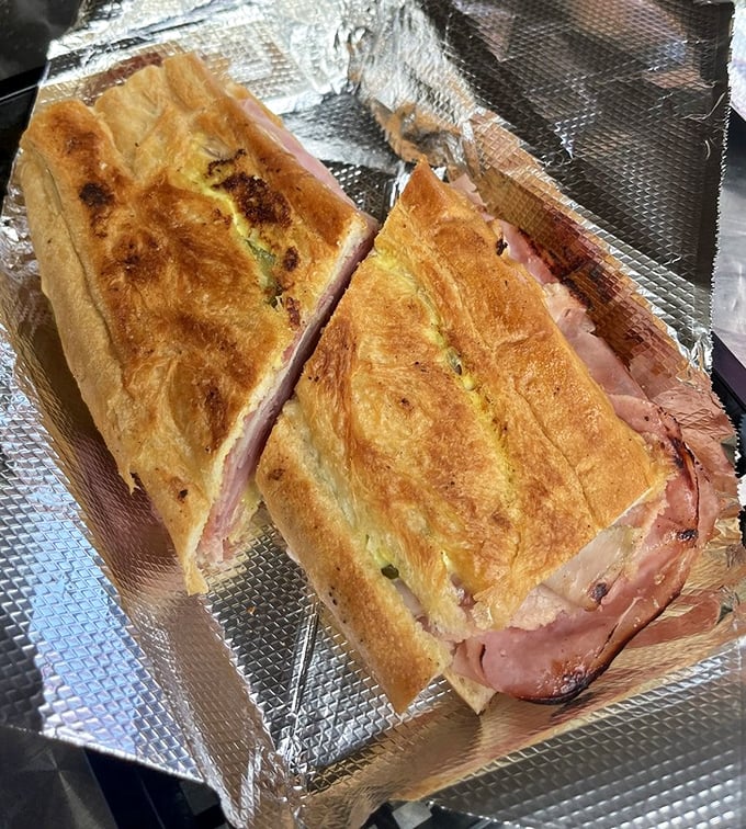 Behold the star attraction: pressed to golden perfection, layers of ham, pork, and cheese create a sandwich worth crossing county lines for.