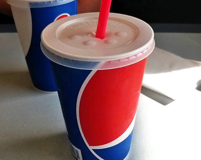 These aren't just beverages &ndash; they're liquid nostalgia in classic red and blue cups, promising sweet relief from whatever ails you.