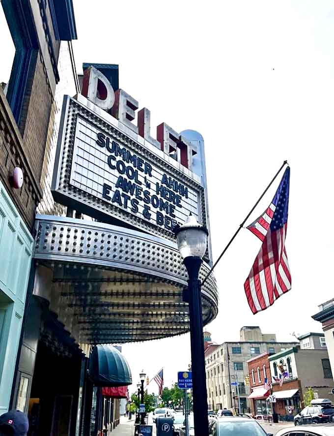 The historic Delft Bistro's marquee still lights up the night, now announcing culinary performances instead of Hollywood features.