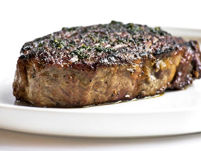 This Delmonico steak isn't just aged &ndash; it's achieved wisdom. The perfect crust whispers secrets of proper heat and patience to anyone willing to listen.