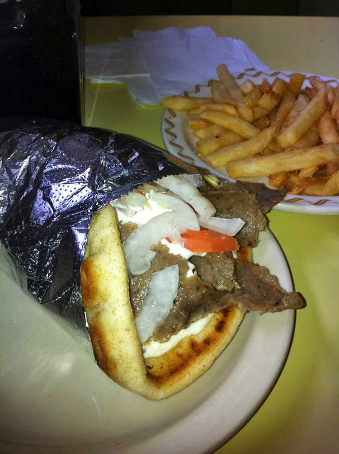 This gyro isn't playing games &ndash; tender, seasoned meat sliced from a traditional vertical rotisserie, nestled in warm pita with fresh veggies and cooling tzatziki.