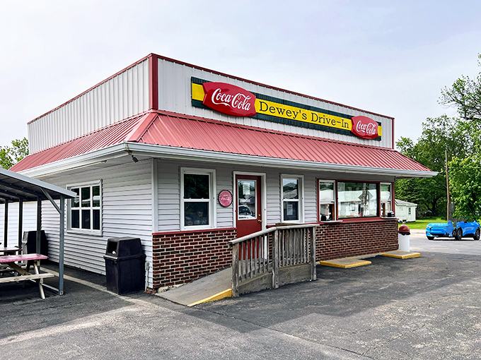 Dewey's Drive-In serves nostalgia between two buns, where milkshakes still require serious straw commitment and calories don't count if consumed outdoors.