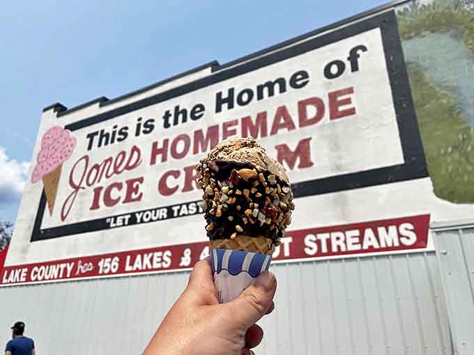 This chocolate-dipped cone rolled in nuts isn't just dessert, it's architecture &ndash; a crunchy fortress protecting creamy treasure.