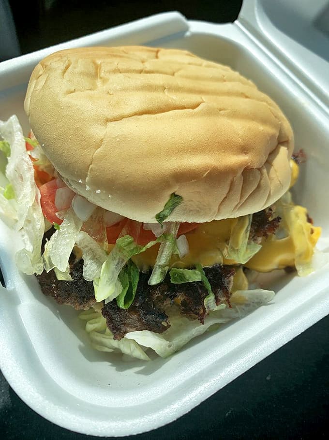 Lettuce, tomato, and cheese cascade over hand-formed patties &ndash; proof that perfection doesn't require fancy ingredients, just respect for tradition.