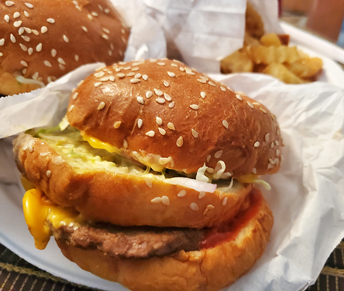 Double Decker Cheeseburger: A beautiful burger balancing act &ndash; melty cheese cascading over juicy patties, nestled in a fresh bun. Simple perfection that needs no fancy frills.