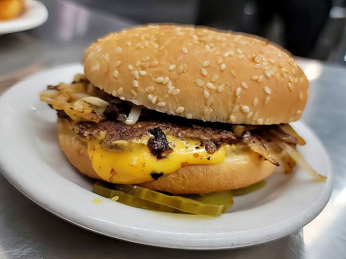 A perfectly crafted cheeseburger rests on its paper throne, the melted cheese and toasted bun promising satisfaction with every bite.