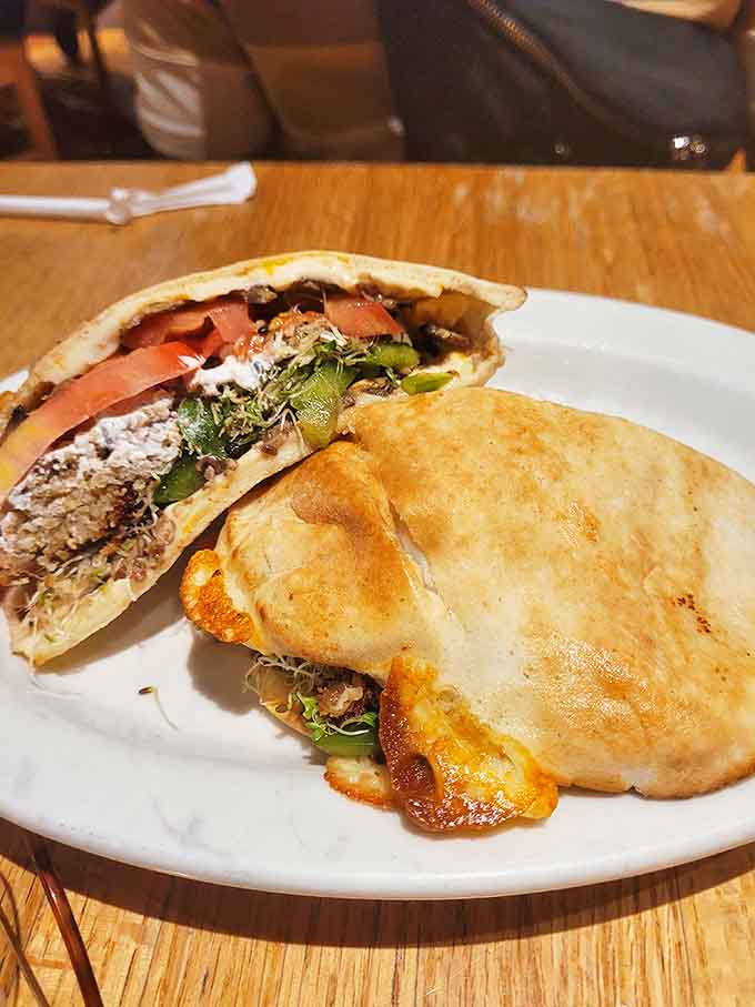 Falafel Pita: Crispy on the outside, tender inside &ndash; Tommy's legendary falafel nestles in warm pita with fresh veggies and tahini sauce for a handheld masterpiece.