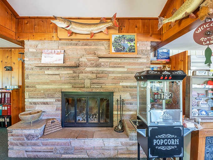 The stone fireplace stands sentinel in the lodge, topped with a trophy catch that silently promises similar glory to hopeful anglers.